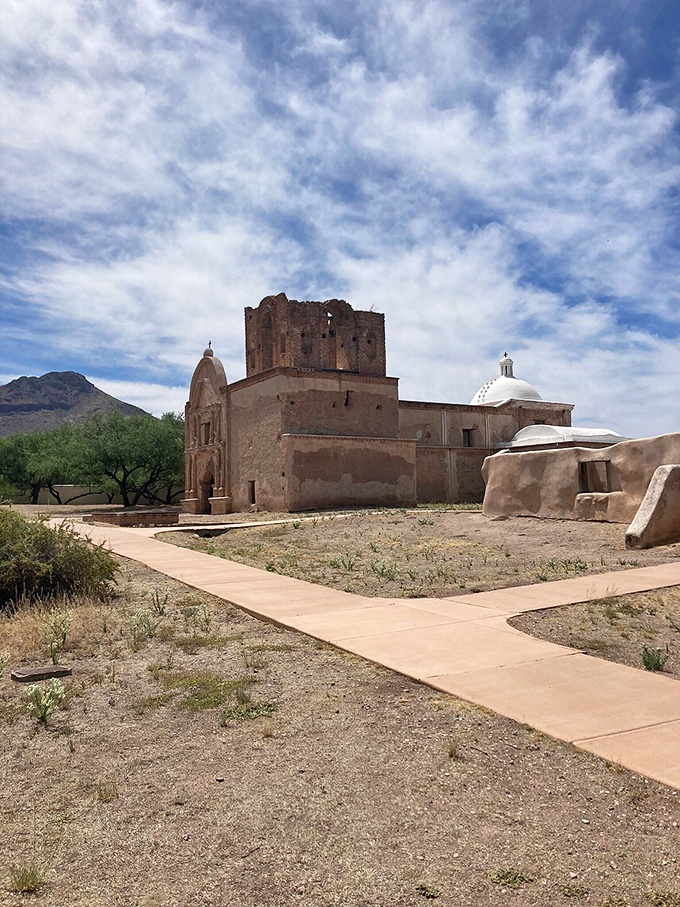 Talk about a room with a view! Tumacacori's silhouette against those mountains is more photogenic than a supermodel at sunset.