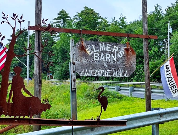 Between American flags and rustic metal art, the weathered sign welcomes visitors like an old friend sharing secrets.