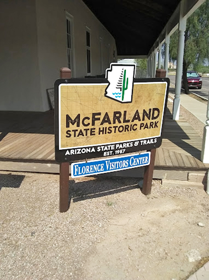 The park's welcoming sign stands proudly against the desert backdrop, a gateway to Arizona's territorial tales.