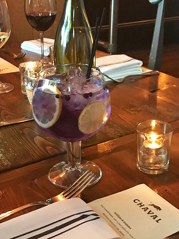 This isn't just a gin and tonic, it's a purple potion of happiness. Garnished with citrus and served in a glass big enough to swim in.
