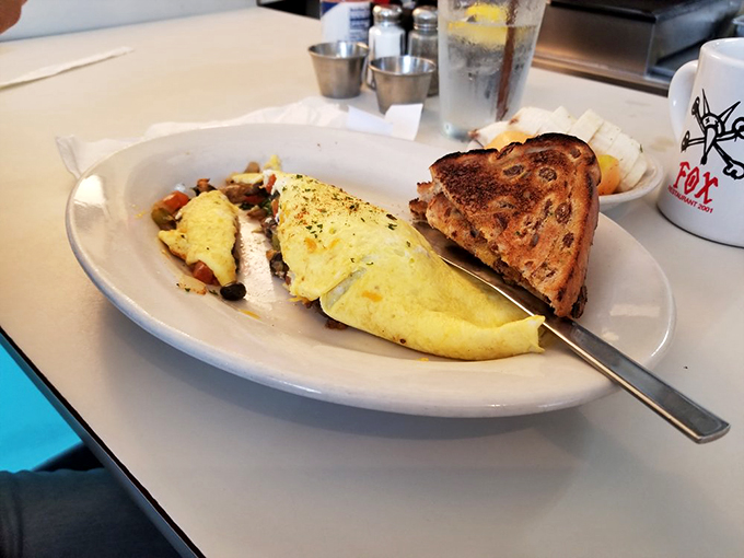 Rock your taste buds! The Lemmy Omelet cranks up the flavor with a veggie medley and a pesto sauce that screams delicious.