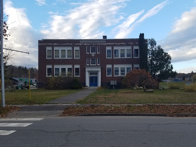 This stately brick schoolhouse has found new life as Waterfall Arts, where creativity flows as freely as the nearby Passagassawakeag River. Photo credit: MapMaker 14