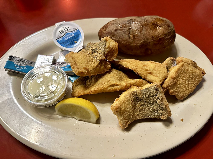 Lake Superior's finest catch, golden-fried to perfection, served with a baked potato and that essential lemon wedge for brightening.