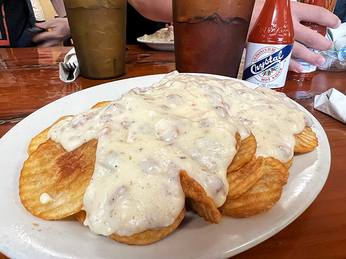 Biscuits so good, they should be illegal! These golden discs swim in a sea of creamy gravy that's basically a warm hug for your stomach. 
