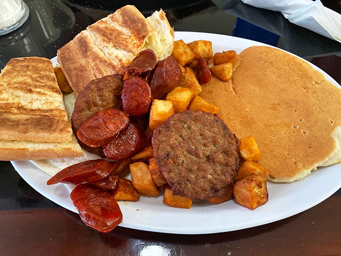 Breakfast of champions... and regular folks too! This plate is so loaded, it could probably bench press your morning hunger away. Photo credit: Cafe Caribe
