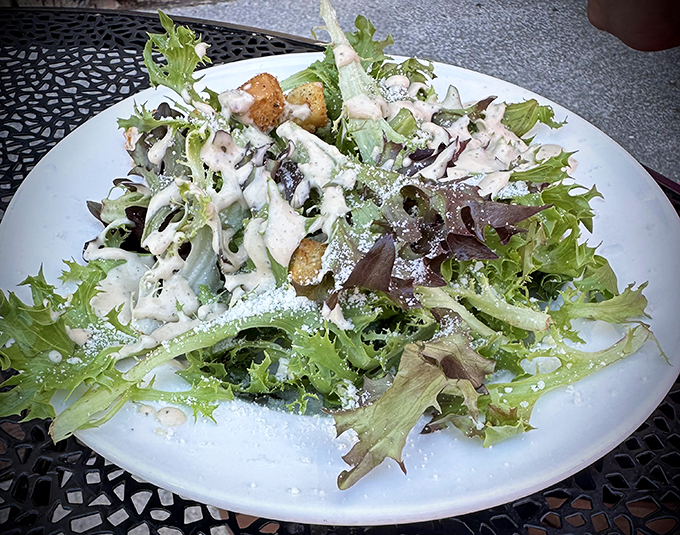 Who knew leaves could be so exciting? This Caesar salad is a crunchy, creamy masterpiece that would make Julius himself say, "Et tu, delicious?" Photo credit: Louis and Elaine