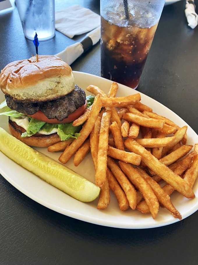 Burger bliss on a plate: This classic beauty could make even the most dedicated health nut consider a cheat day. Those fries? Pure golden temptation.