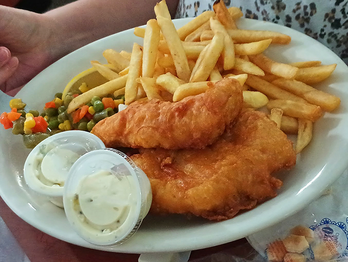 Golden-battered fish that's crunchier than a fall leaf in Michigan. Paired with crispy fries, it's a plate of pure, deep-fried bliss.