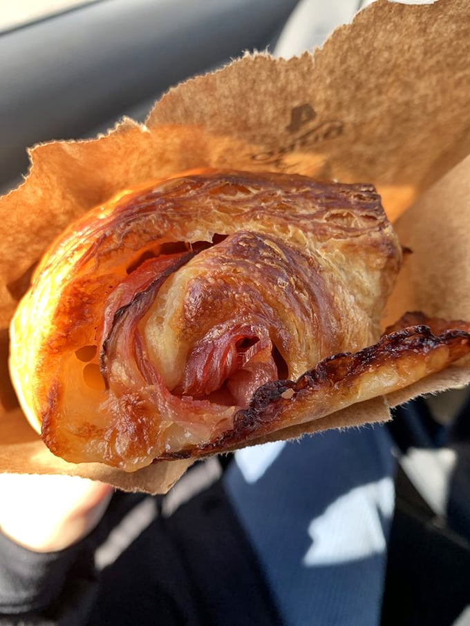 Holy ham and cheese, Batman! This croissant is so flaky, it could give a French pastry chef an identity crisis.