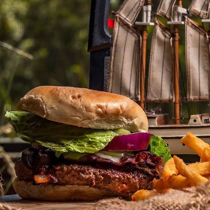 Who knew landlubbers could feast like kings? This burger's stacked higher than a lighthouse and twice as attention-grabbing. Photo credit: The Great Catch by Taste of Boston