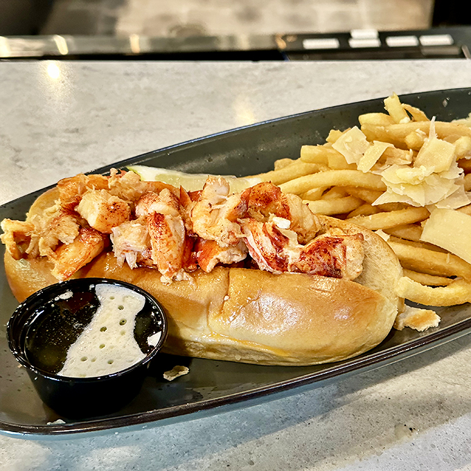 Holy mackerel! This lobster roll is bursting at the seams. It's not just a sandwich, it's a crustacean celebration.