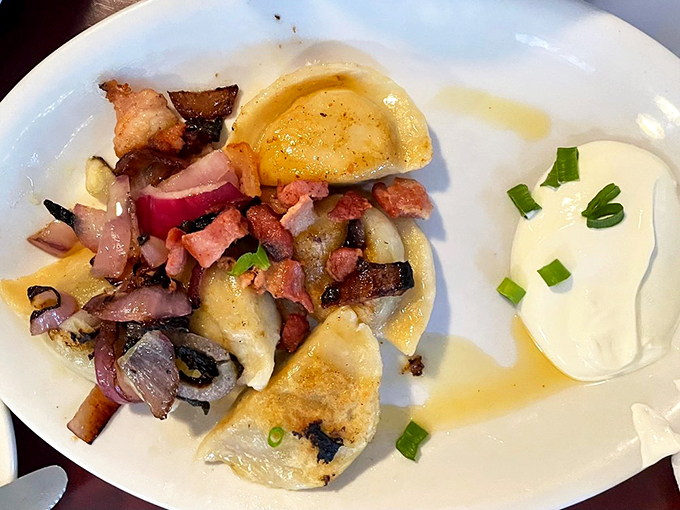 Pierogi perfection on a plate! These little pockets of joy are like Eastern European ravioli &ndash; if ravioli went to finishing school and got all fancy. Photo credit: Janis A.