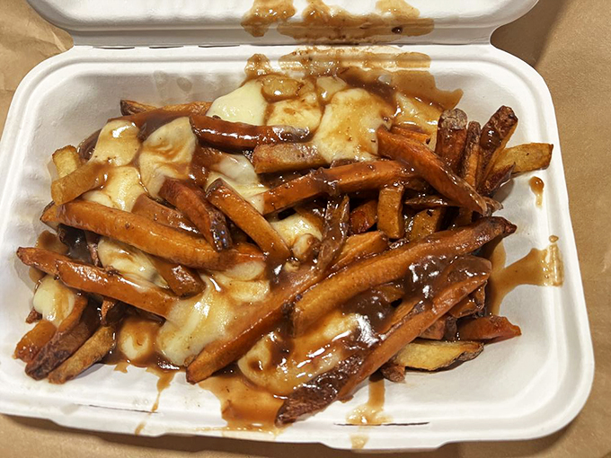 Poutine perfection! These golden fries, smothered in gravy and cheese curds, are the comfort food equivalent of a warm hug from grandma.