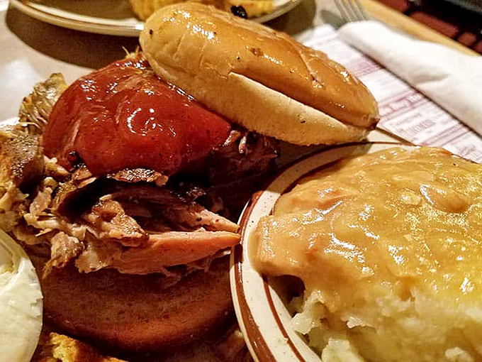 Holy smokes! This pulled pork sandwich is a flavor explosion waiting to happen. It's so good, you might forget your table manners and lick the plate.