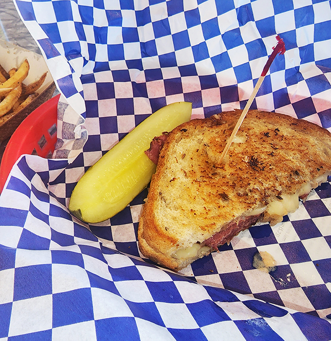 Behold, the Reuben in all its glory! Layers of corned beef and sauerkraut nestled between golden-grilled bread &ndash; it's like a warm hug for your taste buds.