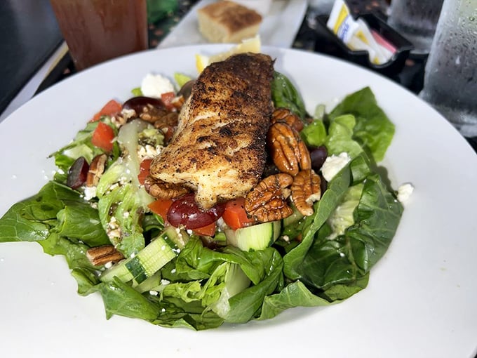 Who knew healthy could look this good? This vibrant salad topped with perfectly seared salmon is like summer on a plate. Photo credit: Larry G.
