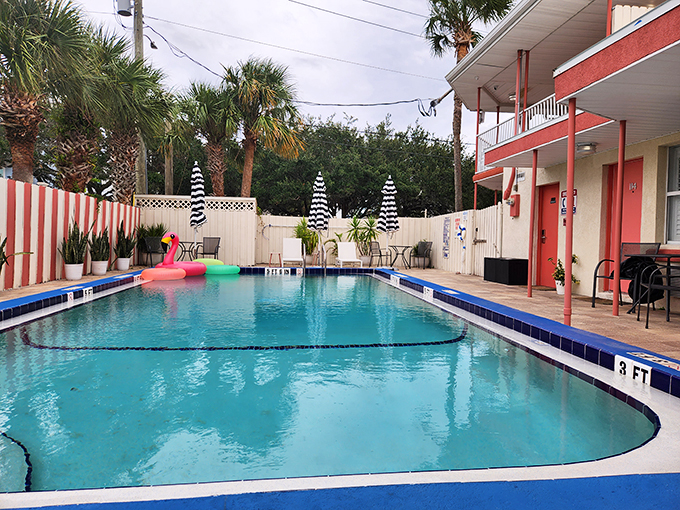 Dive into nostalgia! This kidney-shaped pool, complete with flamingo float, is begging for your best synchronized swimming routine.