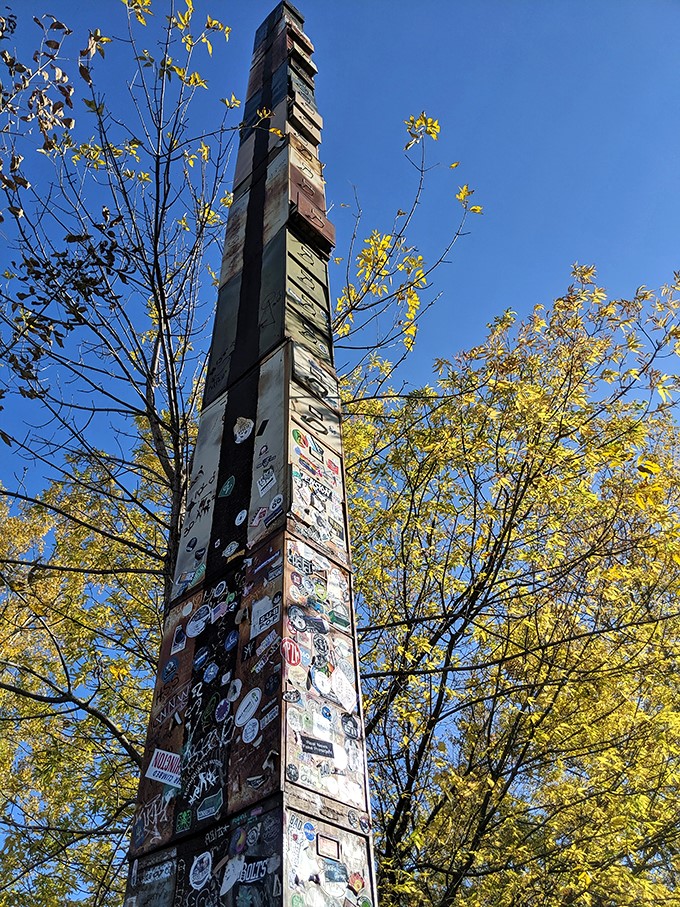 Autumn leaves frame this peculiar landmark. It's as if Mother Nature herself couldn't resist posing for a selfie with this offbeat attraction.