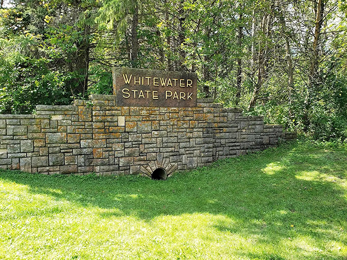 A stone sentinel guards the entrance to a world of cascading adventures.