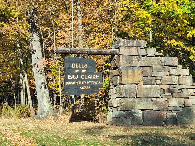 Welcome to nature's own rock concert! This rustic sign and stacked stone pillar are like the opening act for the main event.