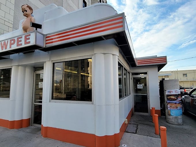 Look at that adorable mascot! It's like a cherub and a burger had a baby, and it's here to bless your taste buds.