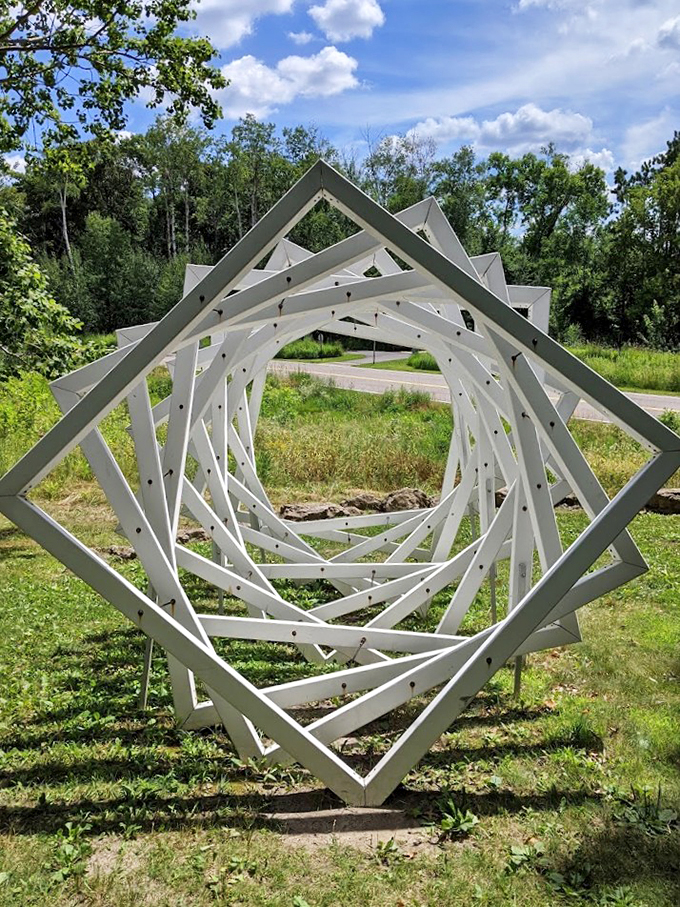 Nature meets geometry in this mesmerizing sculpture. It's like someone decided to give a Rubik's Cube a artistic growth spurt.