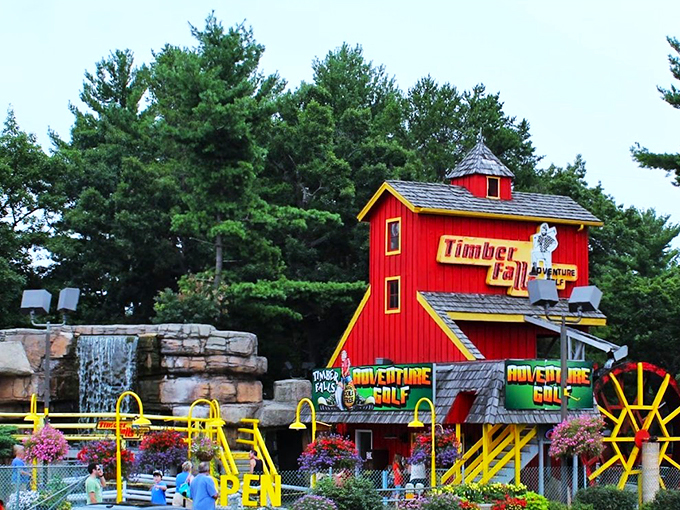 Nature meets adventure as cascading waterfalls and blooming flowers create a backdrop for mini-golf mastery.