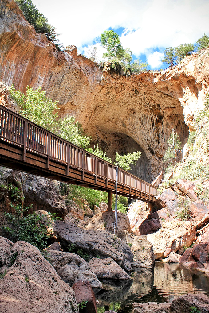 Nature's grand architect at work! This travertine bridge looks like it's playing hide-and-seek with the creek below.
