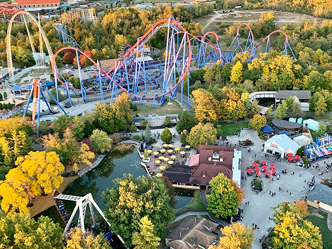 "Thrills meet world travel! Kings Island's colorful entrance invites you to a realm where coasters and cultures collide in spectacular fashion."