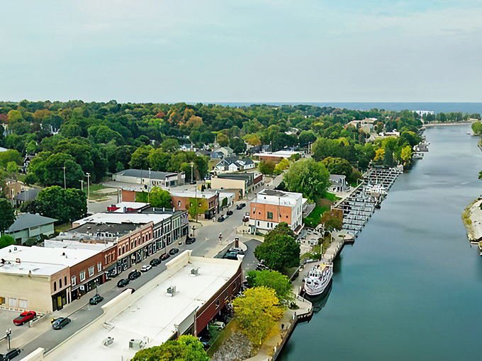 Fall colors paint Manistee's waterfront in nature's finest palette, while boats stand ready for their next adventure.