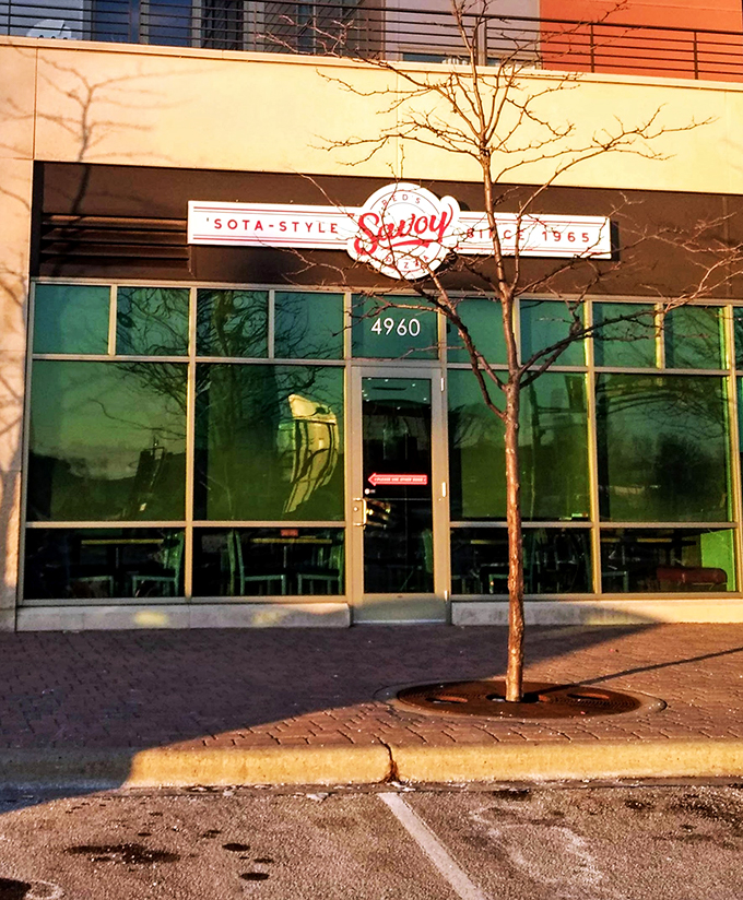 Red's Savoy: Where the sign is as bold as the flavors. Step inside for a slice of Minnesota pizza history.