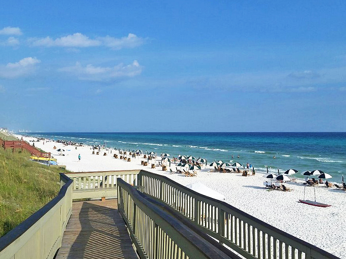 Where pristine boardwalks meet sugar-white sand&mdash;like nature's red carpet leading to the emerald waters of the Gulf.