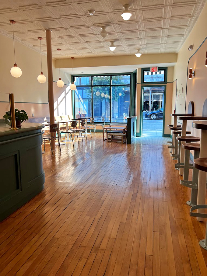 Inside Sweetcream Dairy: Wooden floors, warm lights, and cool treats. It's like a hug for your taste buds!