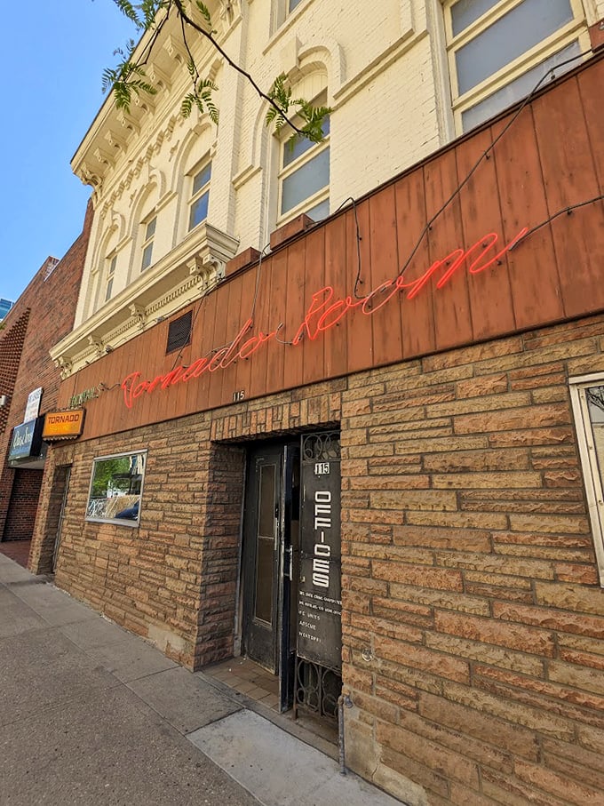 The warm glow of neon against century-old stone tells you you're in for something special.