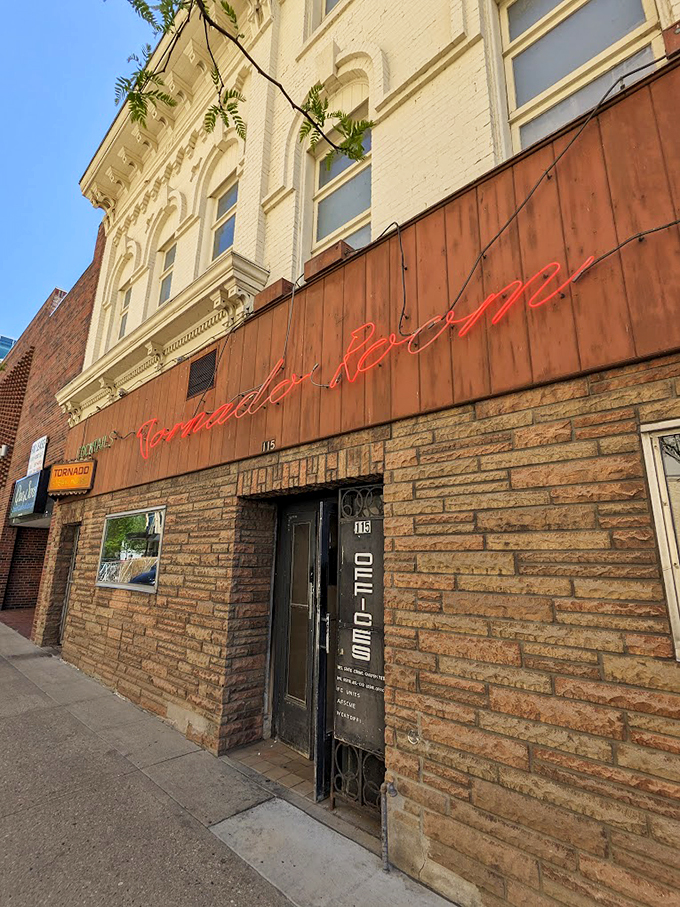 The warm glow of neon against century-old stone tells you you're in for something special.