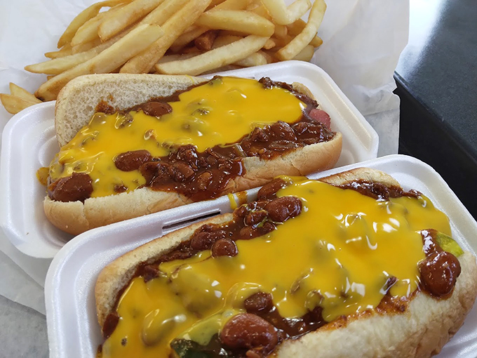 The holy trinity of diner delights: chili dogs, golden fries, and a shake thick enough to stand a spoon in.