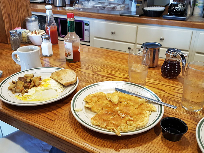 Breakfast of champions? More like breakfast of food poets. These pancakes are so fluffy, they might float right off your plate if not for that river of syrup.