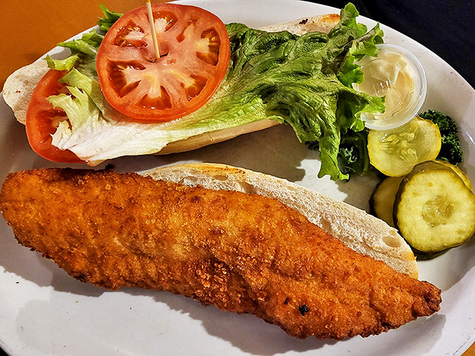 The walleye sandwich, deconstructed. It's like a fishy Jenga tower of deliciousness, daring you to take that first, perfect bite.
