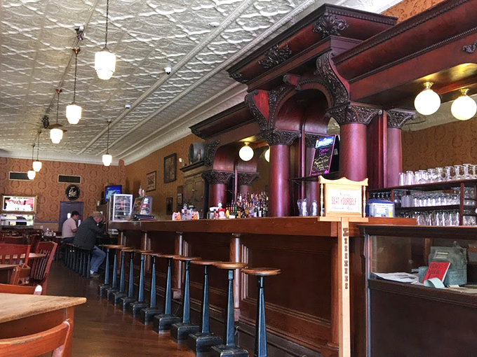 Pull up a stool to nostalgia central! With its pressed tin ceiling and vintage charm, this bar's been serving up good times since before your grandpa was knee-high to a barstool.