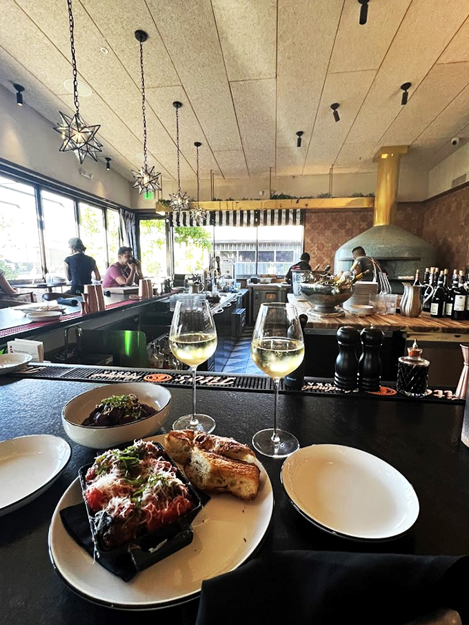 Modern meets cozy in this thoughtfully designed space, where basket-weave lighting and leather seating invite you to linger longer.