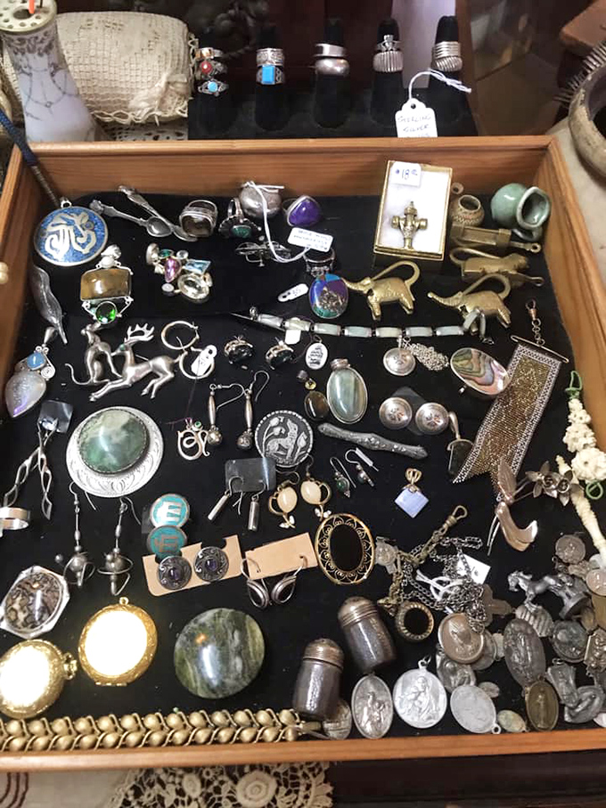 Sterling silver, vintage jewelry, and timeless trinkets sparkle under warm lighting, each piece waiting to tell its tale.