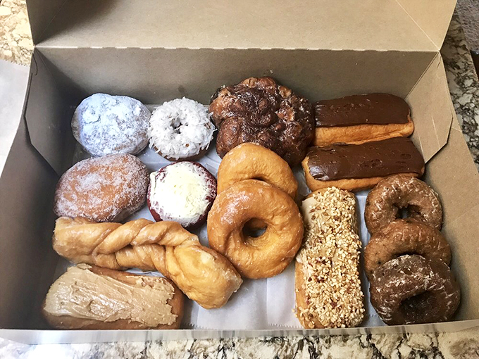 A box of Bill's donuts: the adult version of a toy store haul. Each one's a different flavor of happiness!