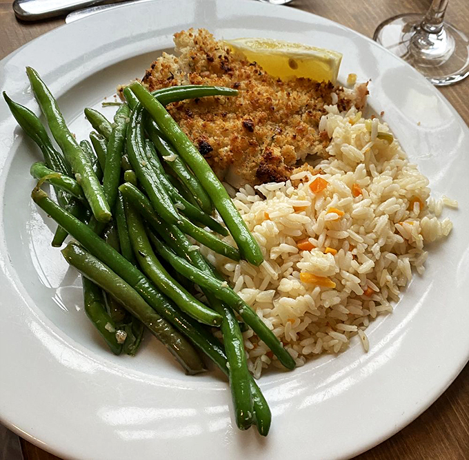 This baked haddock with lemon herb crust isn't just dinner &ndash; it's edible artwork served with perfectly steamed green beans.