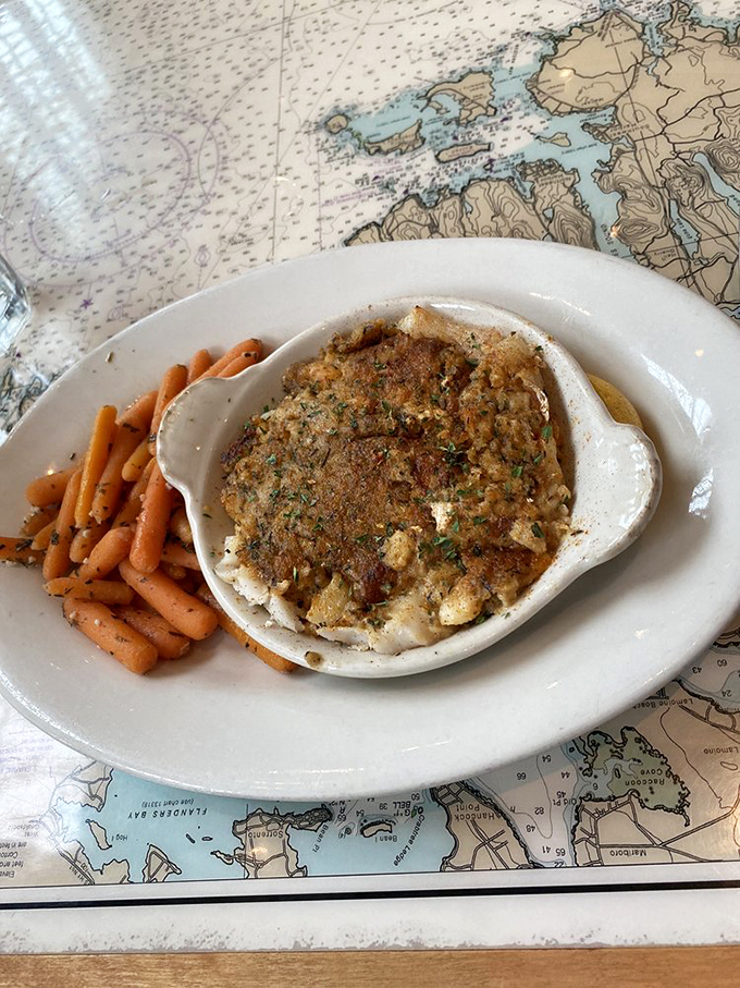 This baked stuffed haddock isn't just dinner - it's a masterpiece of flaky fish and golden-brown topping that'll make you weak in the knees. Photo credit: Lara T.