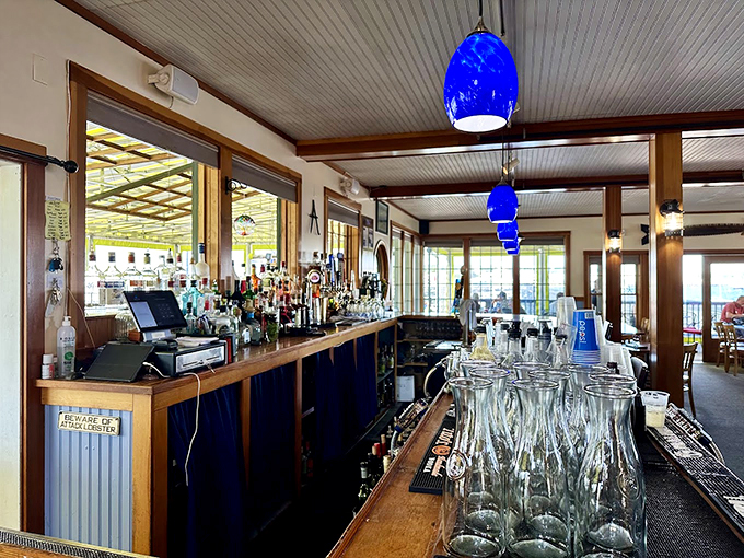 Blue pendant lights cast a maritime glow over the welcoming bar, where the 