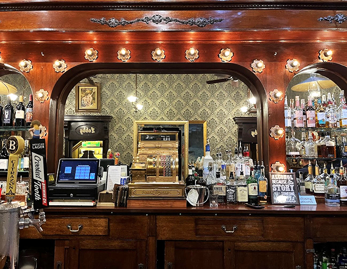 This authentic saloon bar gleams with vintage charm, its antique cash register and ornate woodwork whispering stories of frontier days.