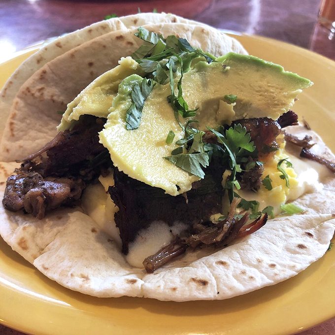 This isn't just a brisket taco &ndash; it's a love letter to Texas wrapped in a tortilla, crowned with perfectly ripe avocado. Photo credit: Andrew V.