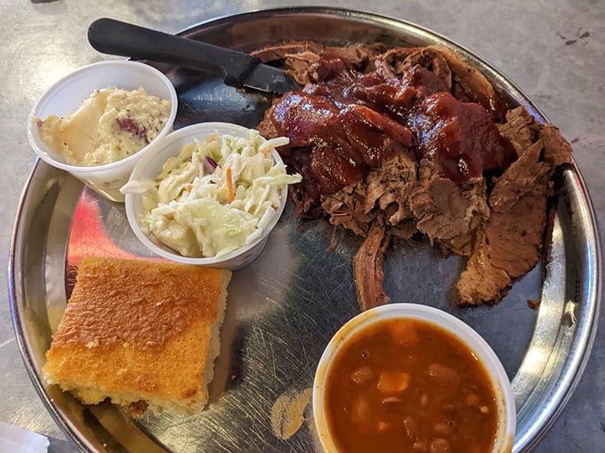 This isn't just a plate; it's a flavor fiesta! The brisket takes center stage, with sides playing perfect backup singers to this meaty rock star.