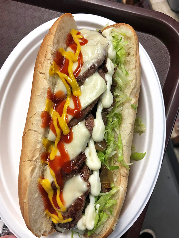 A symphony of melted cheese, fresh lettuce, and perfectly seasoned beef that makes other subs look like they're not even trying.