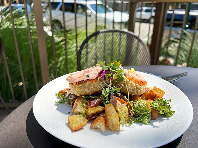 Golden-crusted crab cakes share the spotlight with roasted potatoes and fresh greens&mdash;a plate that's dressed to impress.